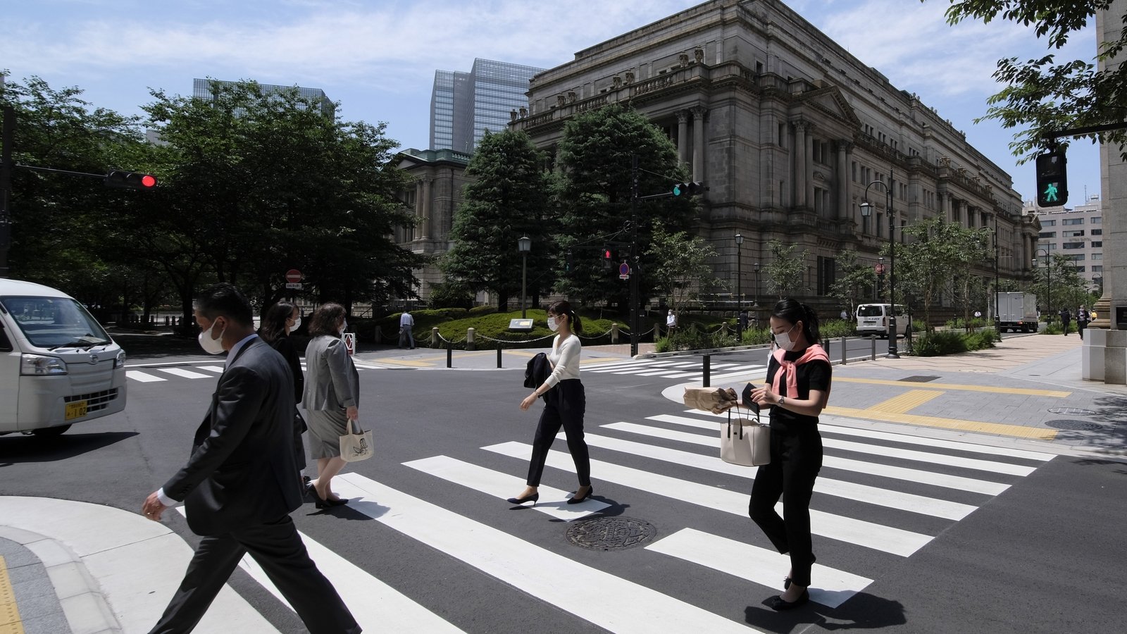 BOJ holds rates steady, keeps future hikes in view