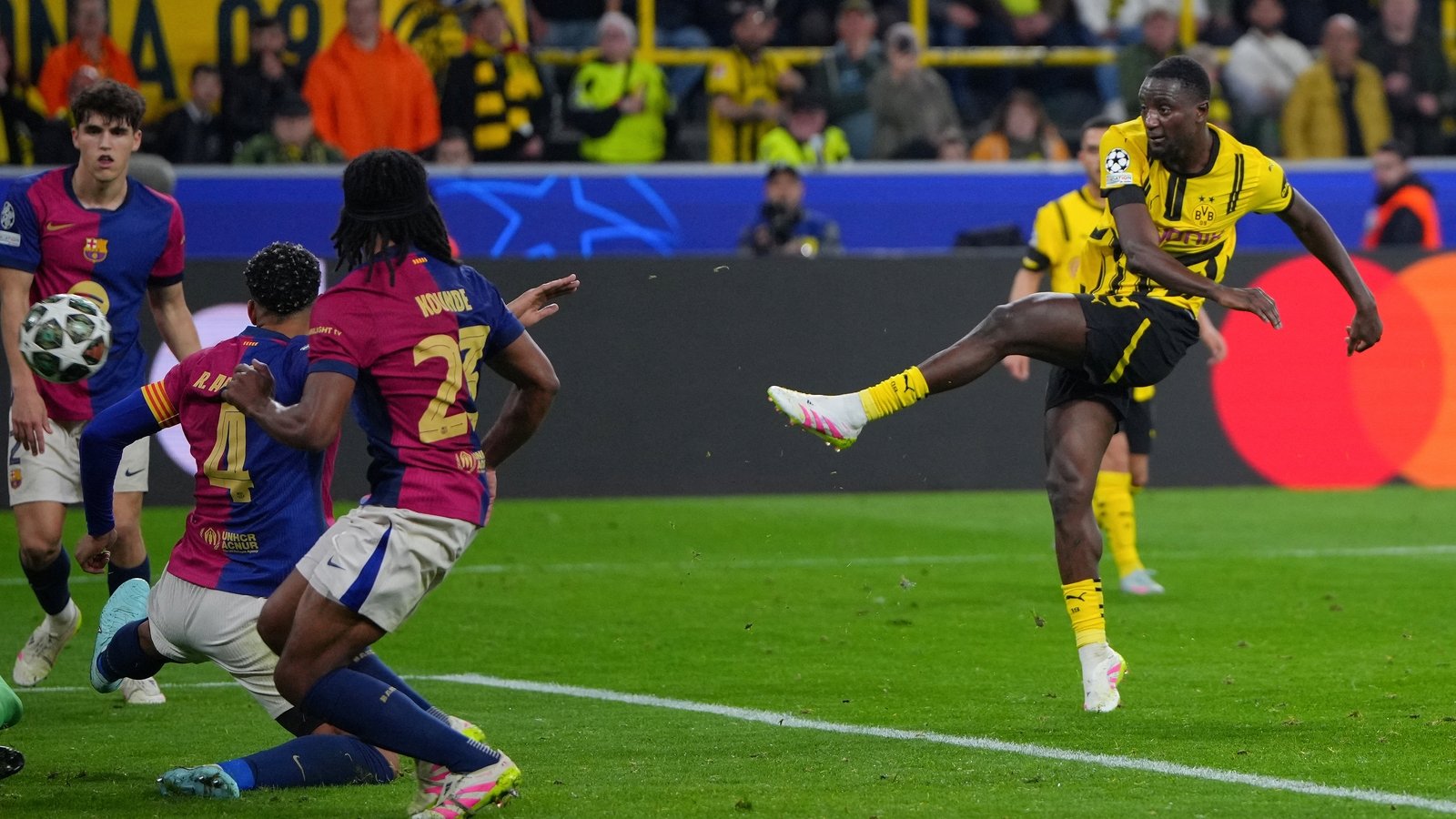 Dortmund victory in vain as Barcelona reach last four
